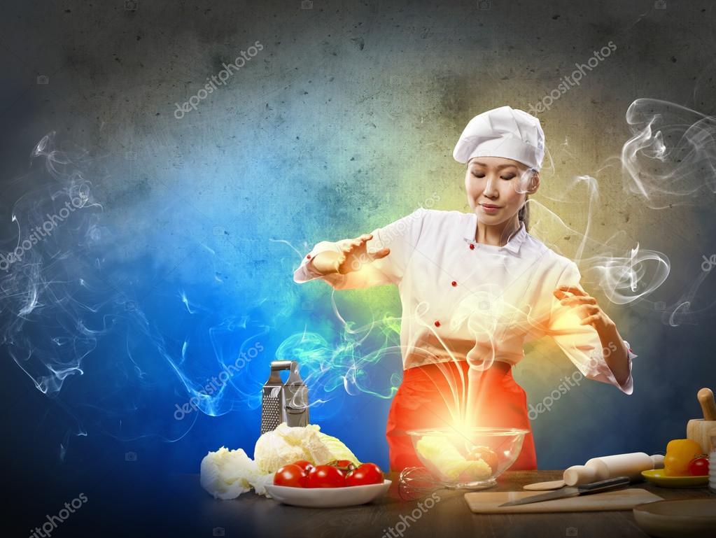 Asian female cooking with magic Stock Photo by ©SergeyNivens 29843911