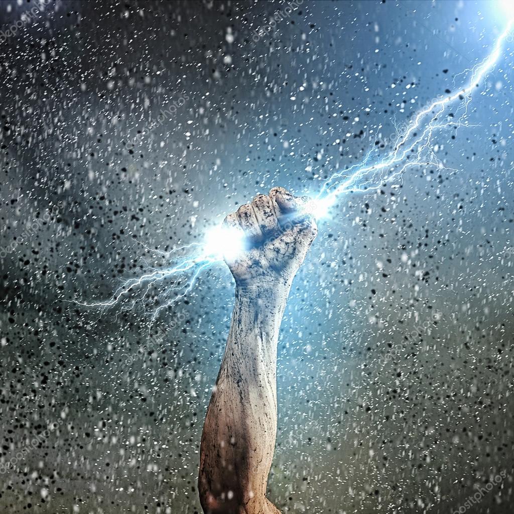 Human hand holding lightning Stock Photo by ©SergeyNivens 30250431
