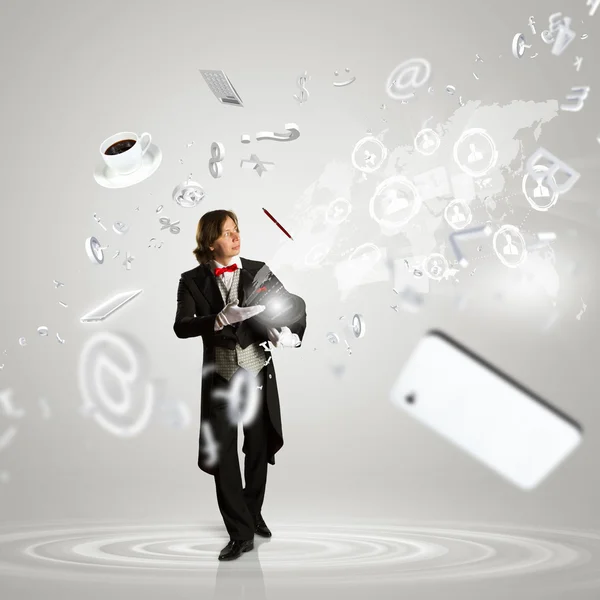 Magician and computer devices Stock Photo by ©SergeyNivens 31087307