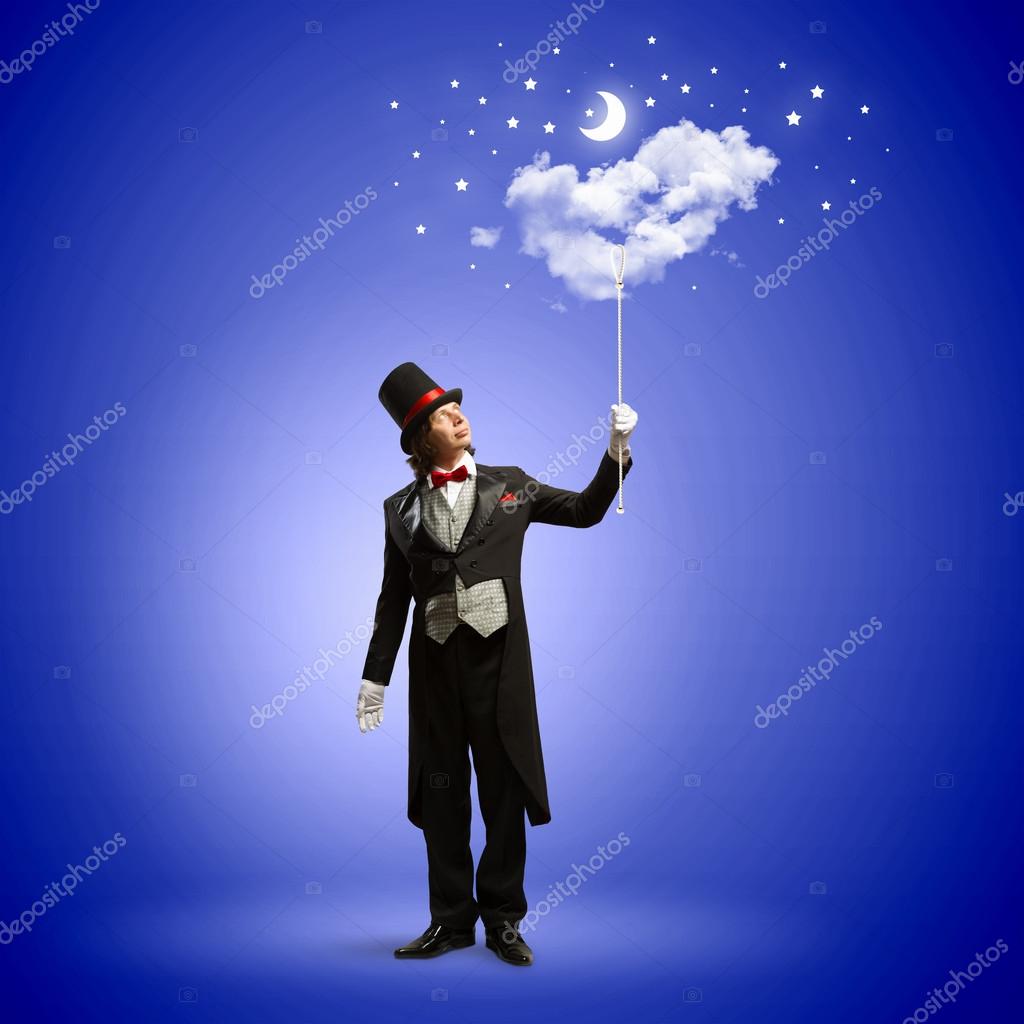 Magician in hat Stock Photo by ©SergeyNivens 31086877