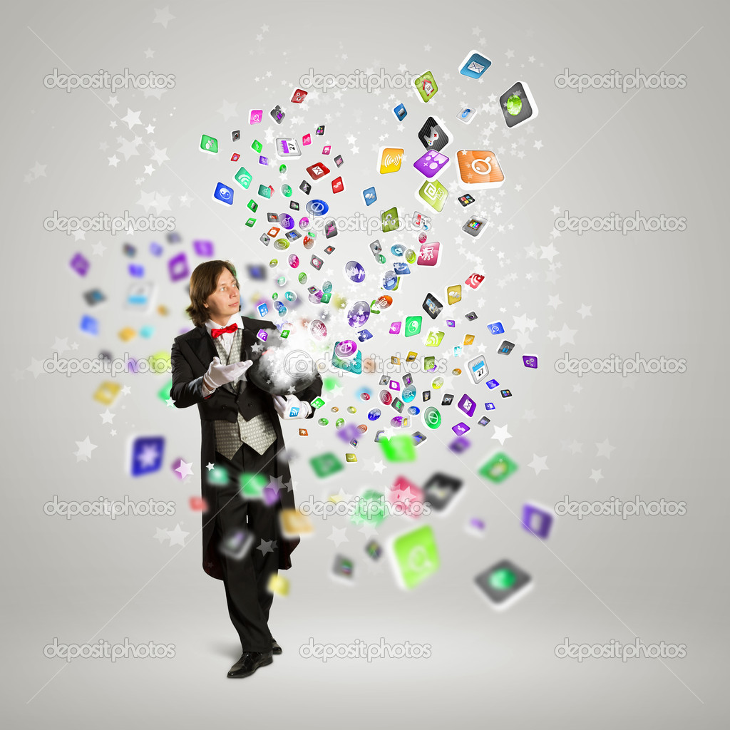 Magician and computer devices Stock Photo by ©SergeyNivens 31087307