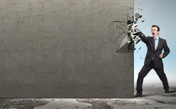 Man breaking wall Stock Photos, Royalty Free Man breaking wall Images ...