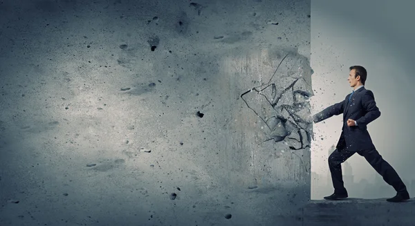 Man breaking wall Stock Photos, Royalty Free Man breaking wall Images ...