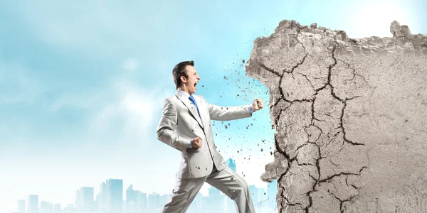 Man breaking wall Stock Photos, Royalty Free Man breaking wall Images ...