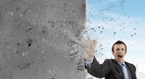 Man breaking wall Stock Photos, Royalty Free Man breaking wall Images ...