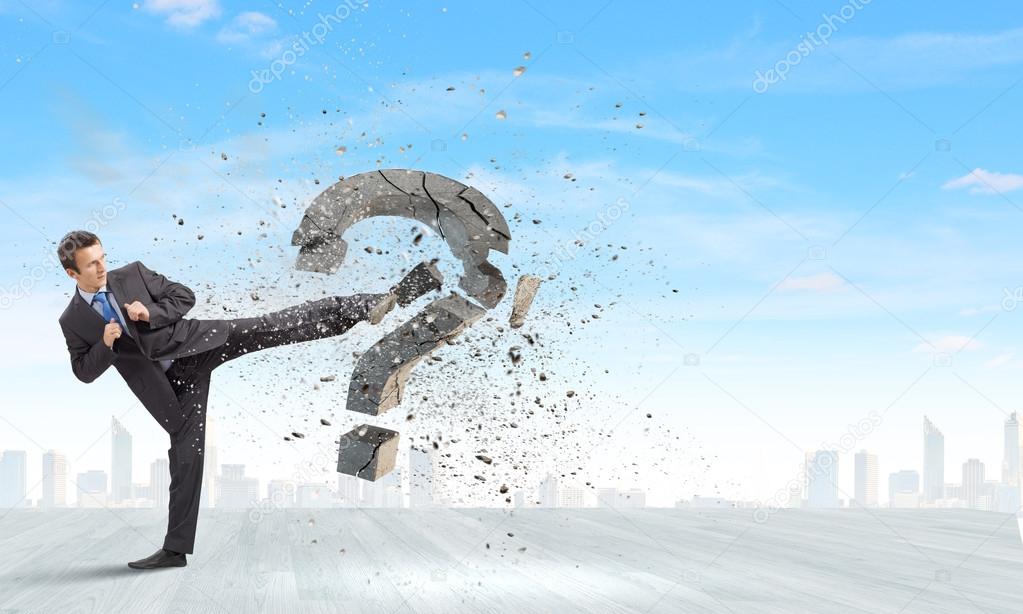 Businessman breaking stone question mark — Stock Photo © SergeyNivens ...