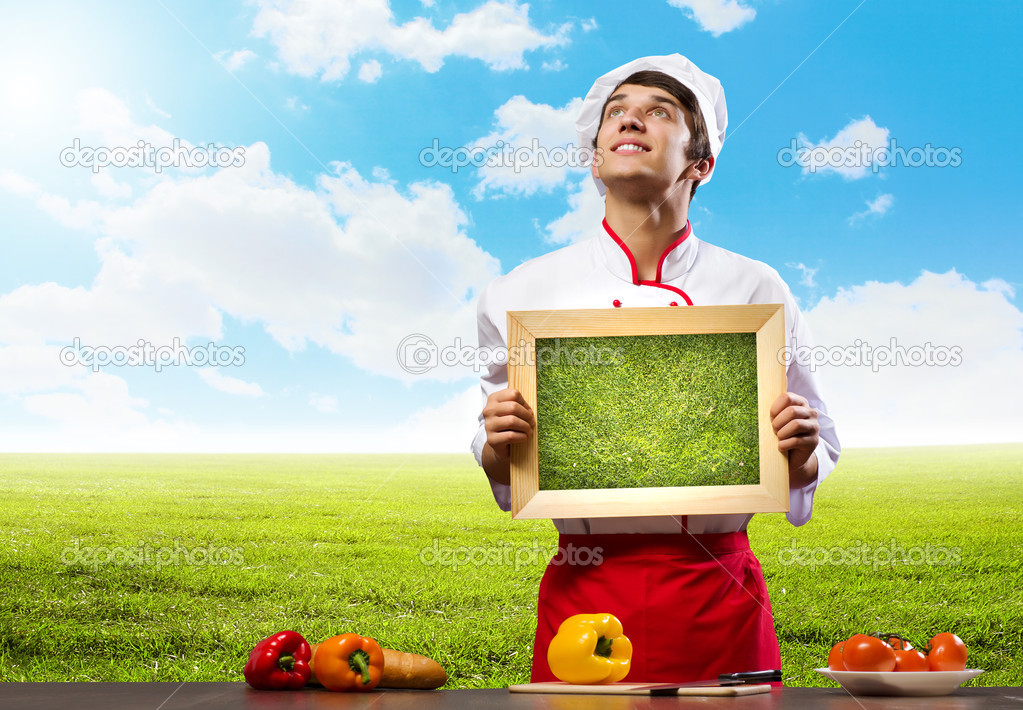 Cook holding photo frame — Stock Photo © SergeyNivens #51753513