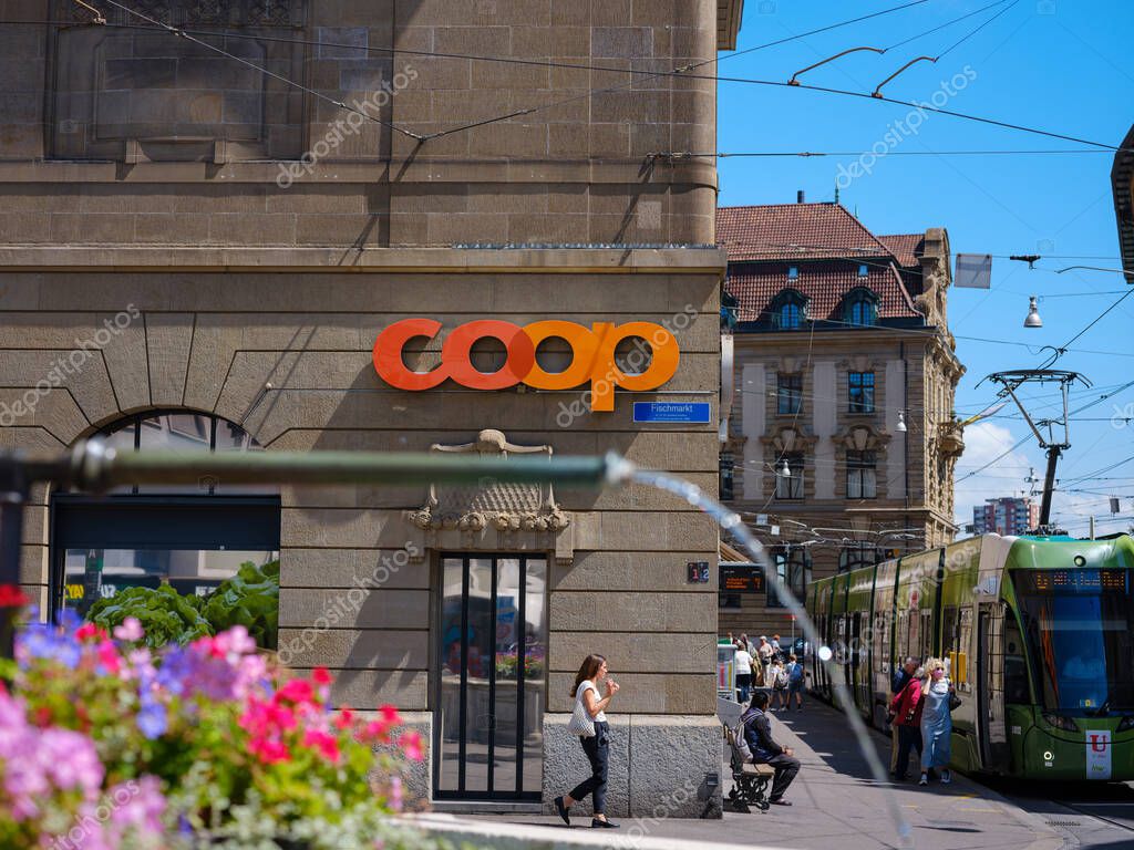 Basel, Switzerland - July 4 2022: Coop sign on a store building. The ...