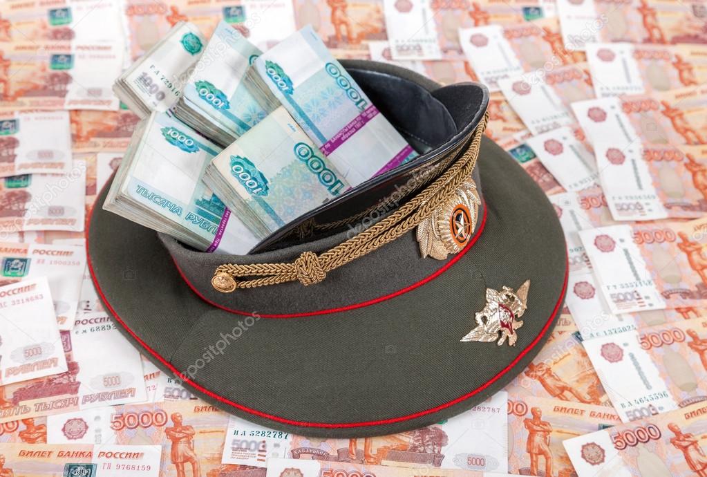 Stack of bundled russian ruble banknotes in the officer's cap — Stock ...