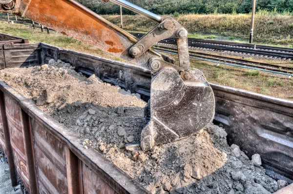 Excavator Loads Gravel Car Train — Stock Photo © artfotoss #4927748