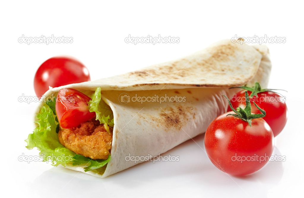 Wrap with fried chicken and vegetables — Stock Photo © magone #47684803