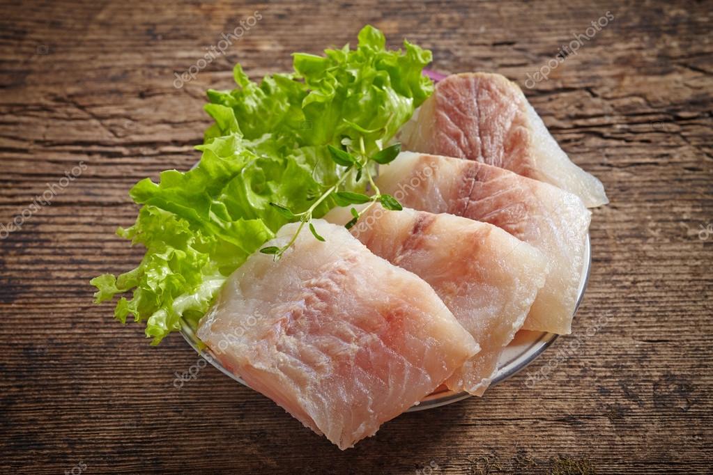Raw hake fish fillet pieces Stock Photo by ©magone 49360837