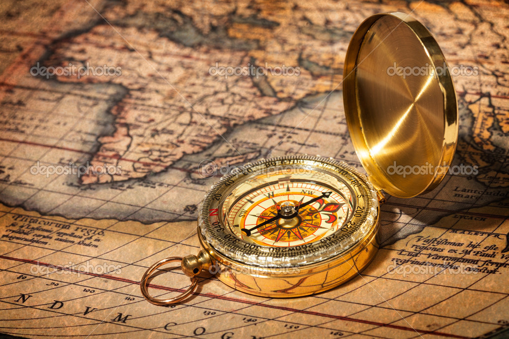 Old vintage golden compass on ancient map Stock Photo by ...