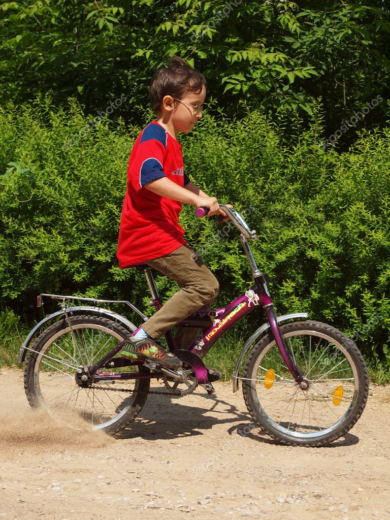 A boy rides a bike – Stock Editorial Photo © index74 #26567623