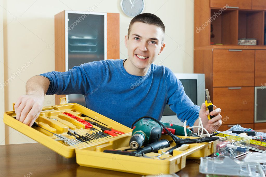 Guy with working tools Stock Photo by ©Jim_Filim 47142561