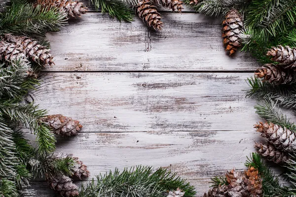 White shabby Christmas border with snow covered pinecones - Stock Image ...