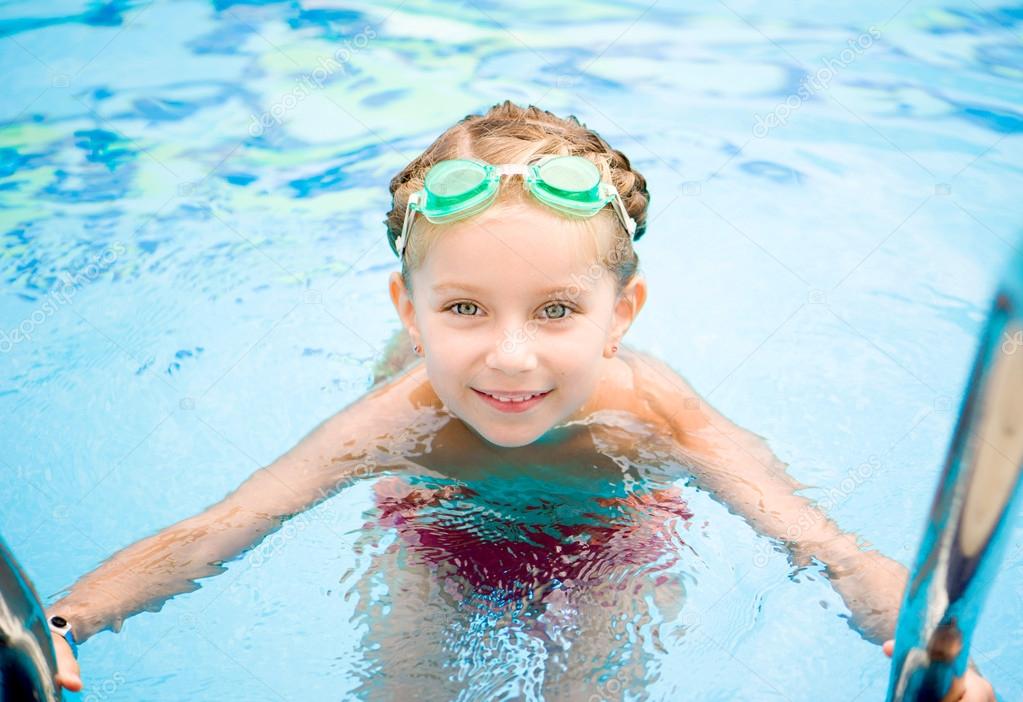Little girl in swimming pool — Stock Photo © tan4ikk #18932711 Little girl in swimming pool — Stock Photo © tan4ikk #18932711