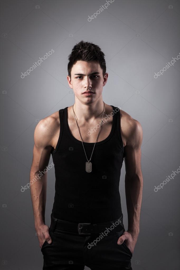 Muscular built man with a dog tags. Stock Photo by ©bloodua 22585635