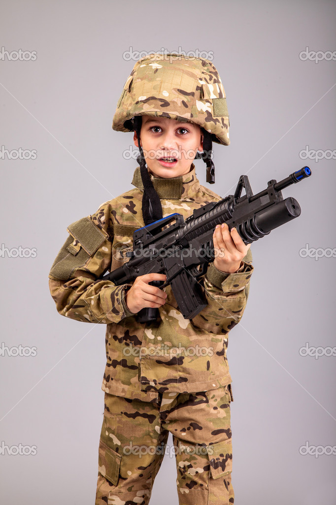 Young boy dressed like a soldier with rifle Stock Photo by ©bloodua ...
