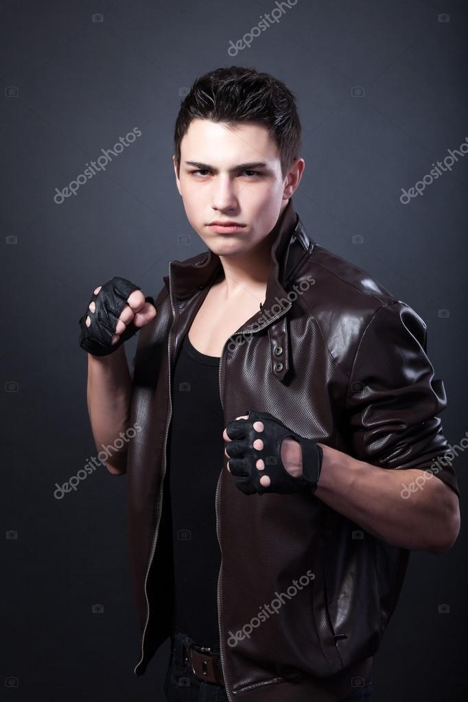 Agressive young man on black — Stock Photo © bloodua #41025701