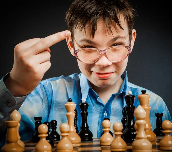 Nerd play chess Stock Photo by ©cookelma 1205015