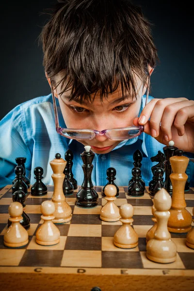 Nerd play chess Stock Photo by ©cookelma 46742341