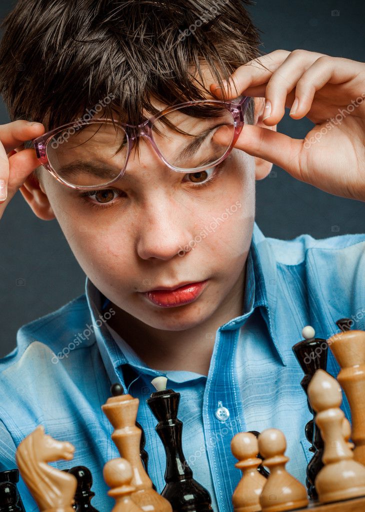 Nerd play chess Stock Photo by ©cookelma 46742341