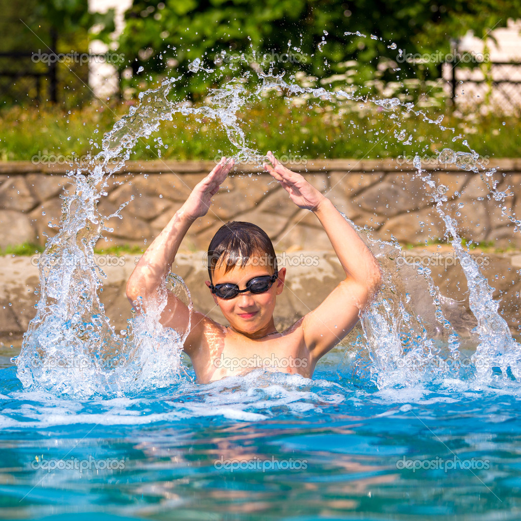 Happy boy in a swimming pool Stock Photo by ©Laures 51482337