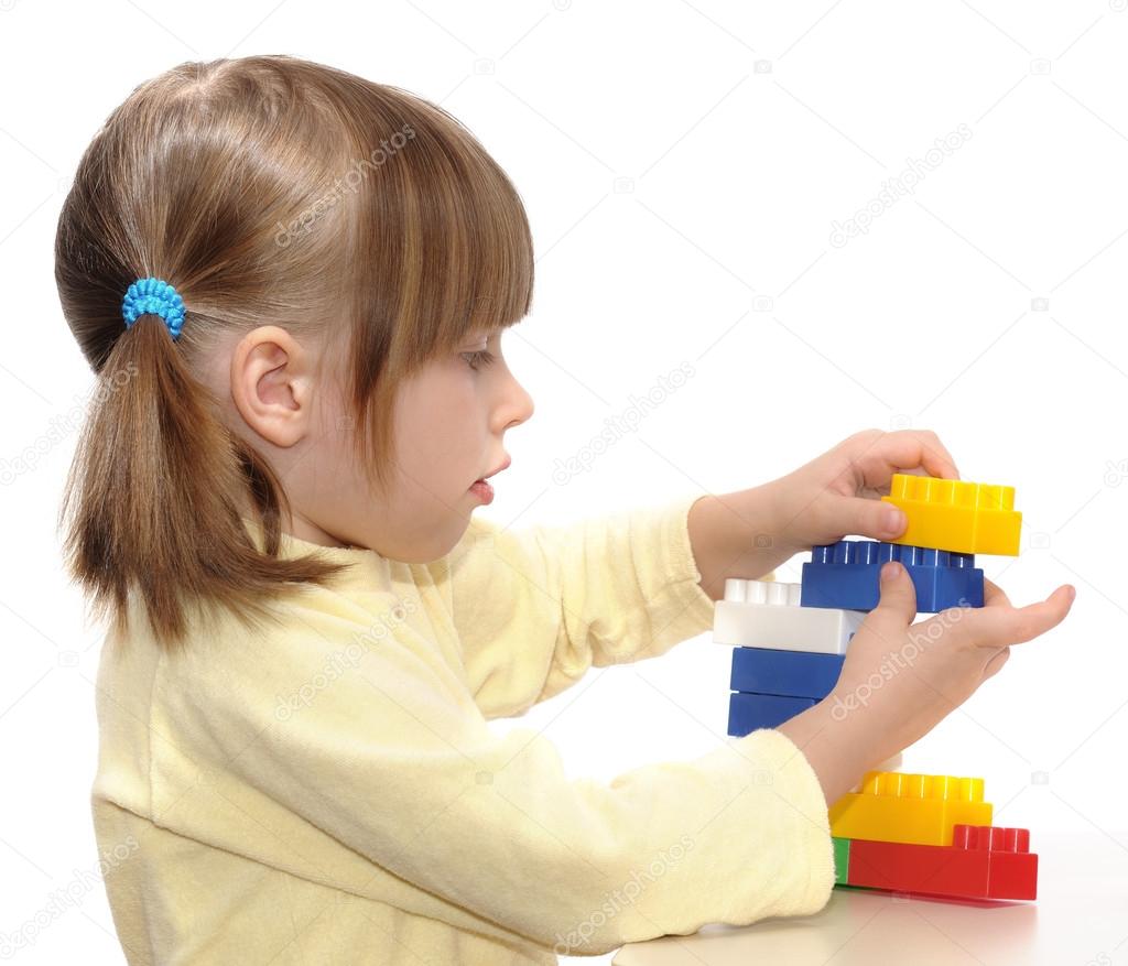 Girl playing with blocks Stock Photo by ©Tsekhmister 34296247