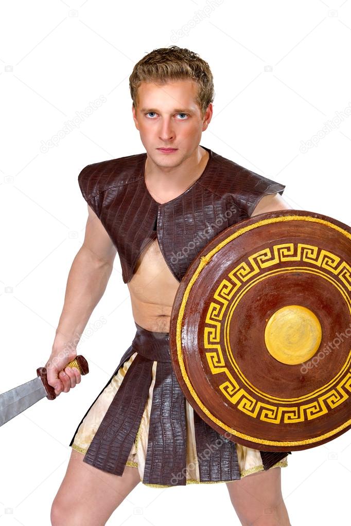 Young male warrior with a shield — Stock Photo © Artex67 #33944981
