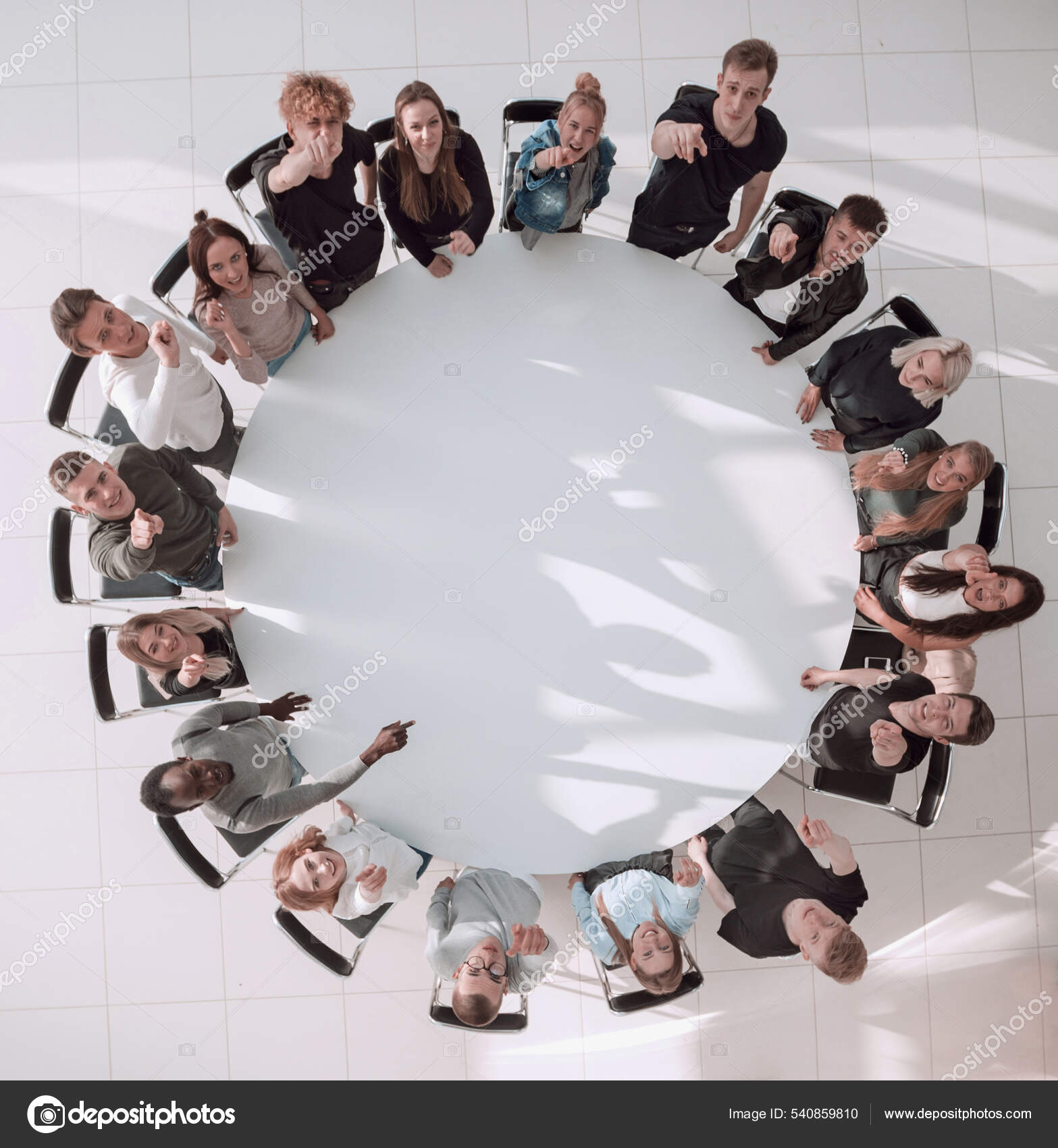 Top view. a group of young people applaud at a group meeting Stock ...