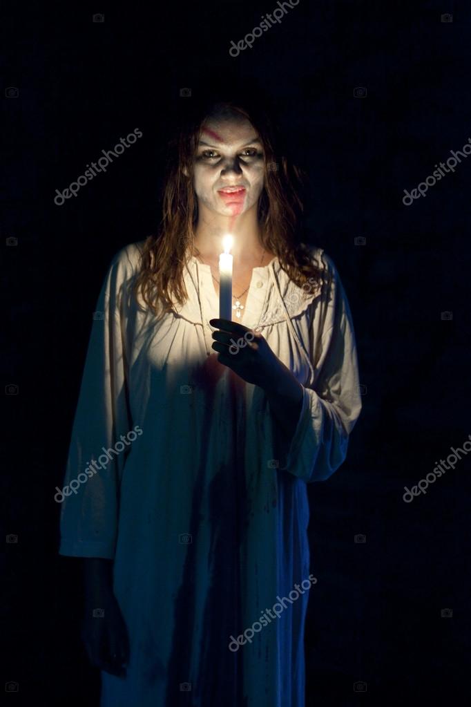 Bloody and scary looking zombie woman Stock Photo by ©arkusha 29656319