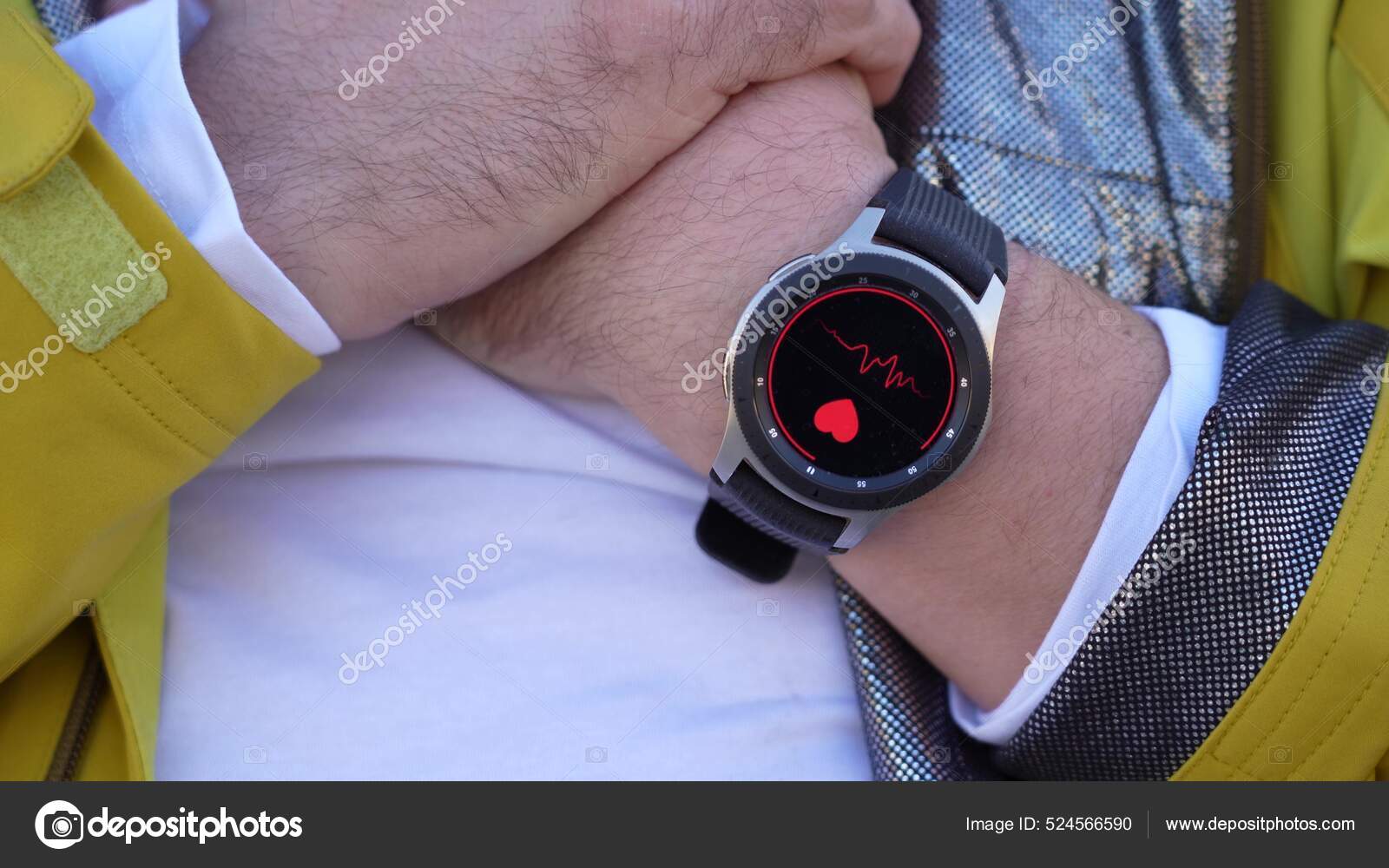 Smart watch measures the pulse on the hand pressed to the heart Stock ...