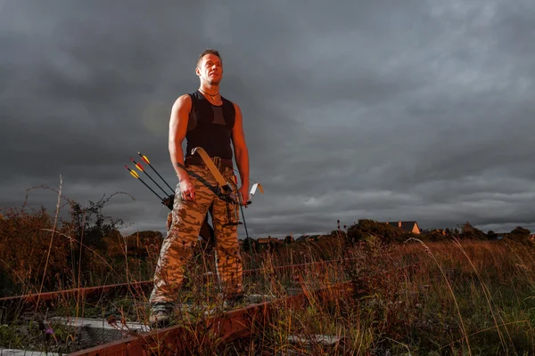 Man with bow and arrows Stock Photo by ©rihardzz 30650611