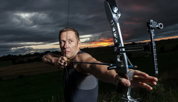 Man with bow and arrows Stock Photo by ©rihardzz 30650611