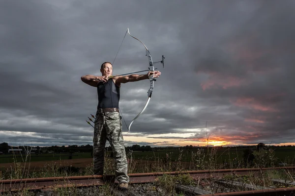Man with bow and arrows Stock Photo by ©rihardzz 30650611
