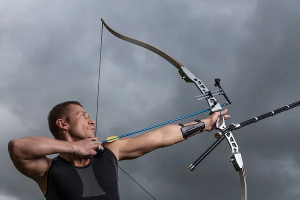 Man with bow and arrows — Stock Photo © rihardzz #34661531
