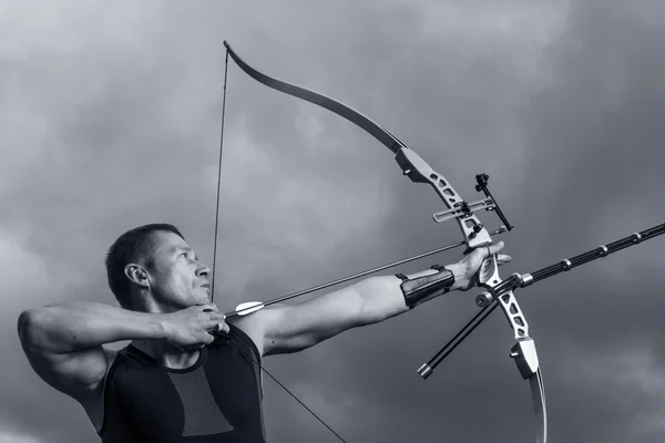 Man with bow and arrows Stock Photo by ©rihardzz 30650611