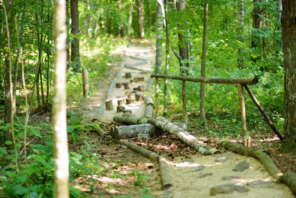 Two sisters on tactile path in barefoot park created to feel the ground ...