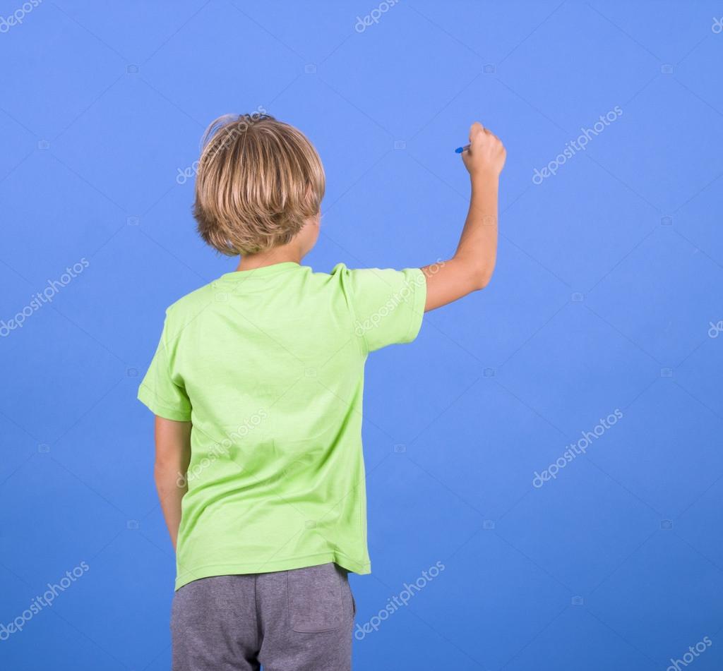 Boy writing on the blue copyspace Stock Photo by ©papa42 30596023