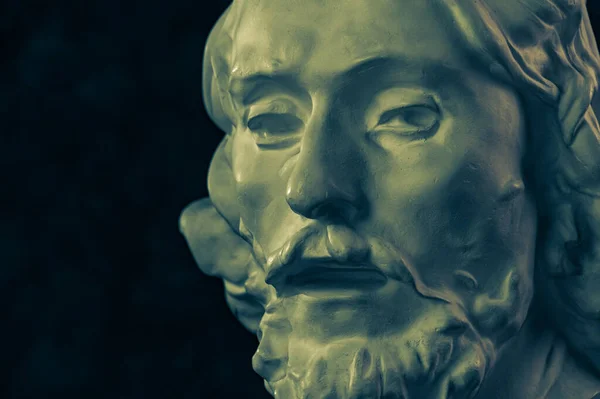 Close up colorful portrait. Gypsum copy of ancient statue of John the Baptist head for artists ...