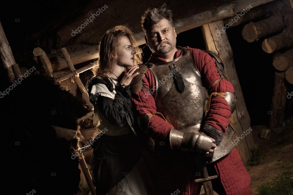 Medieval peasant woman is embracing her knight. Stock Photo by ©bigdan ...