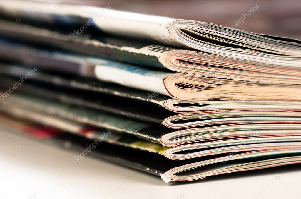 A large stack of magazines piled high. Stock Photo by ©valphoto 20193981