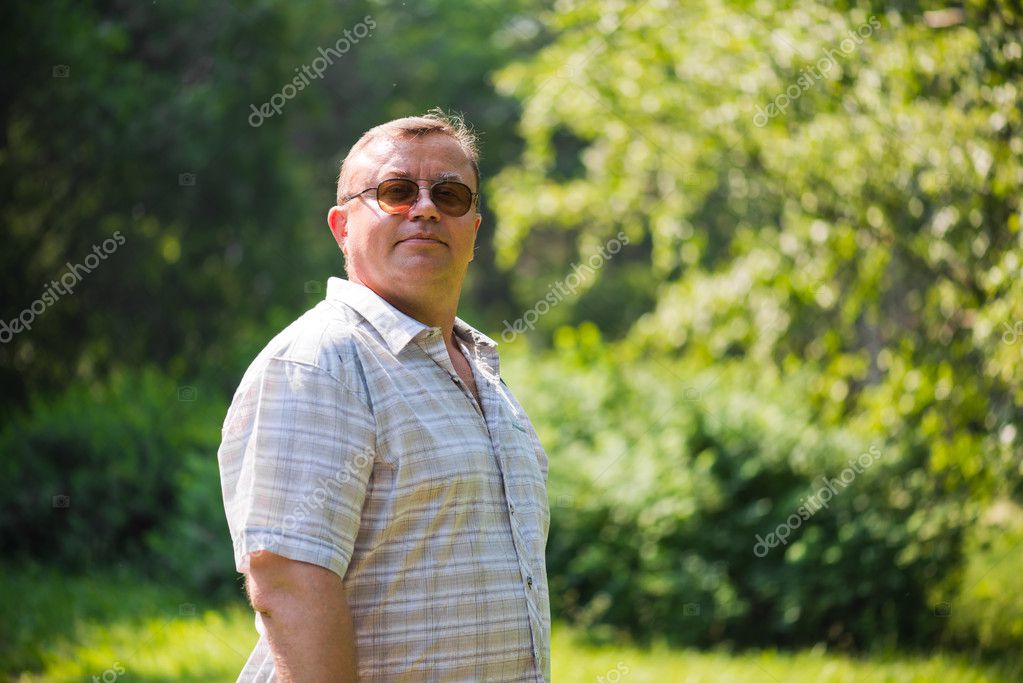 Portrait Of Man Standing Outside In summer Landscape — Stock Photo ...