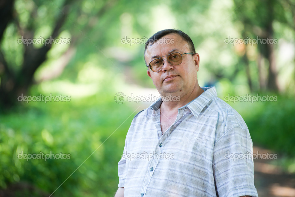 Portrait Of Man Standing Outside In summer Landscape Stock Photo by ...