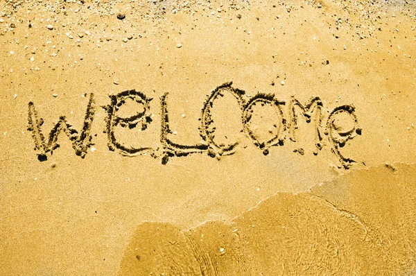 Welcome written in a sandy tropical beach Stock Photo by ©valphoto 45020413