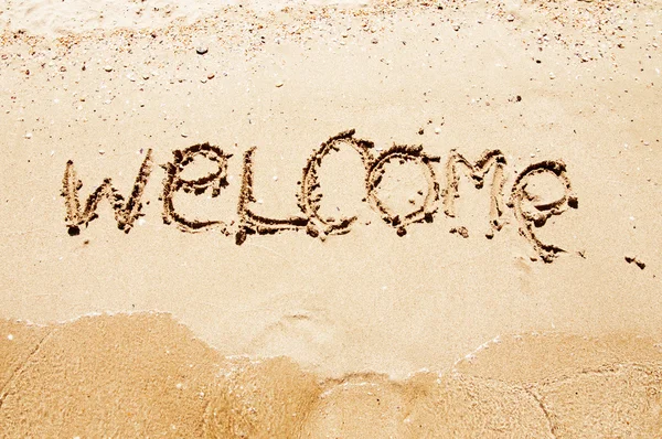 Welcome written in a sandy tropical beach Stock Photo by ©valphoto 45020413
