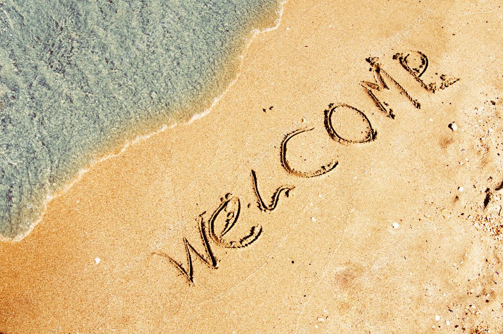 Welcome written in a sandy tropical beach Stock Photo by ©valphoto 45020413
