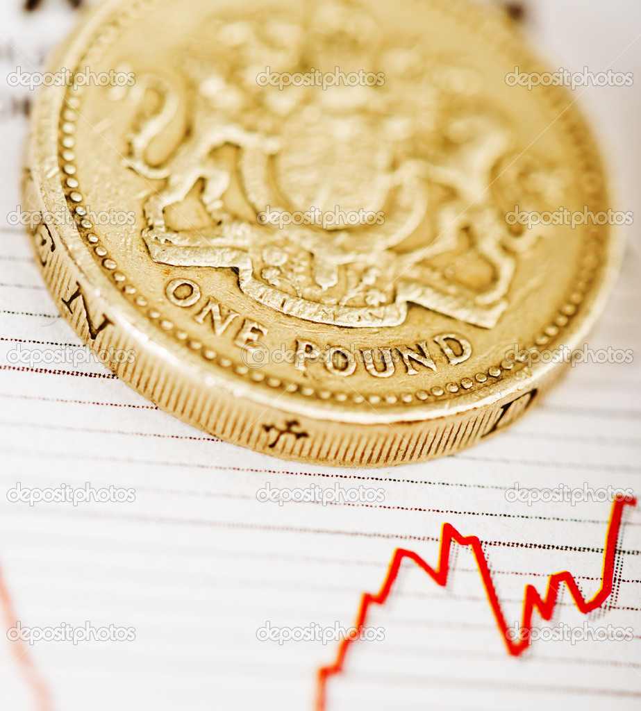 One pound coin on fluctuating graph Stock Photo by ©valphoto 46197123