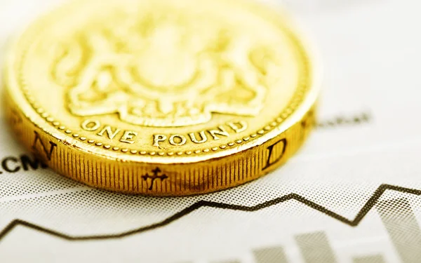 One pound coin on fluctuating graph. - Stock Image - Everypixel